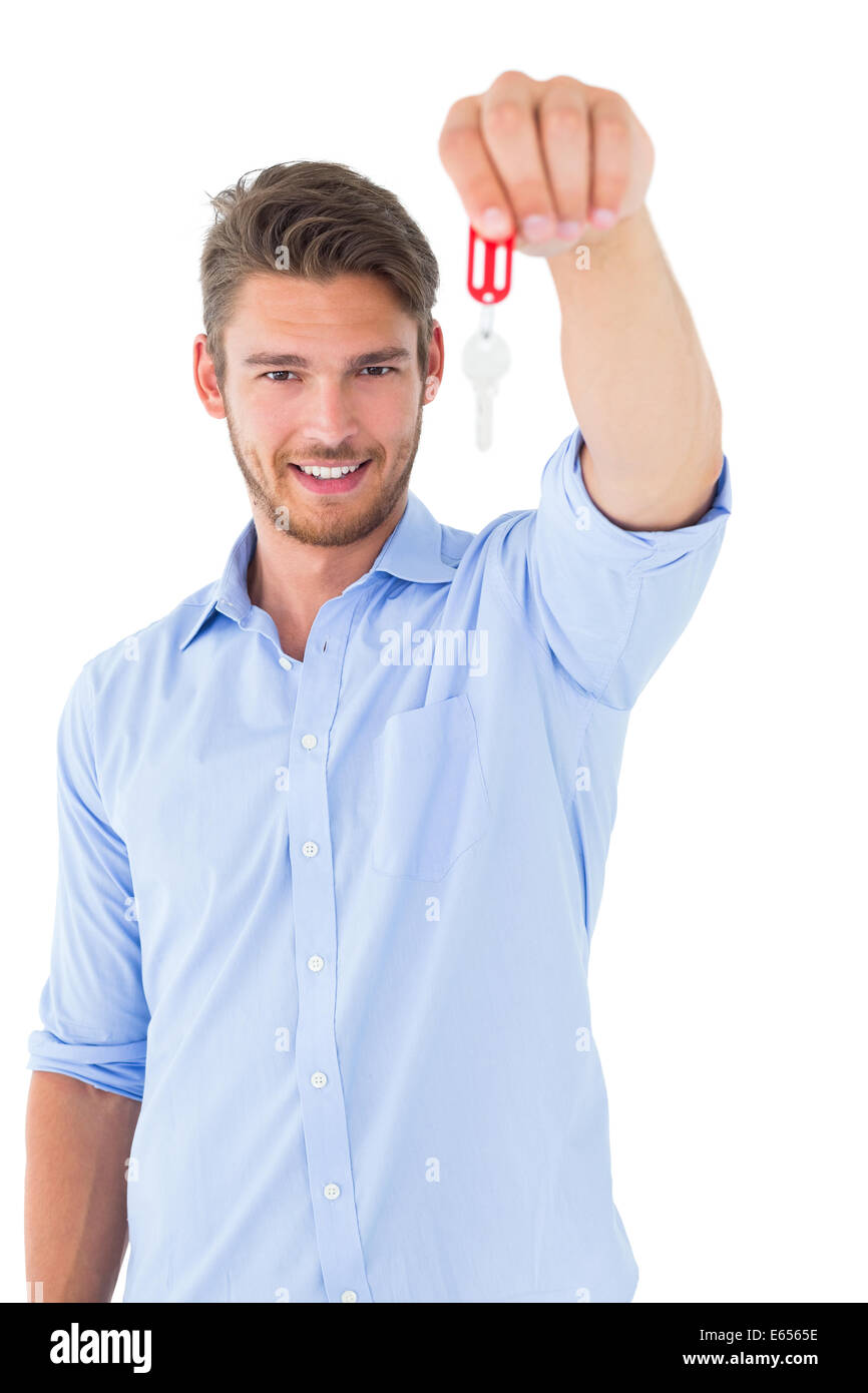 Excited young man showing key hi-res stock photography and images - Alamy
