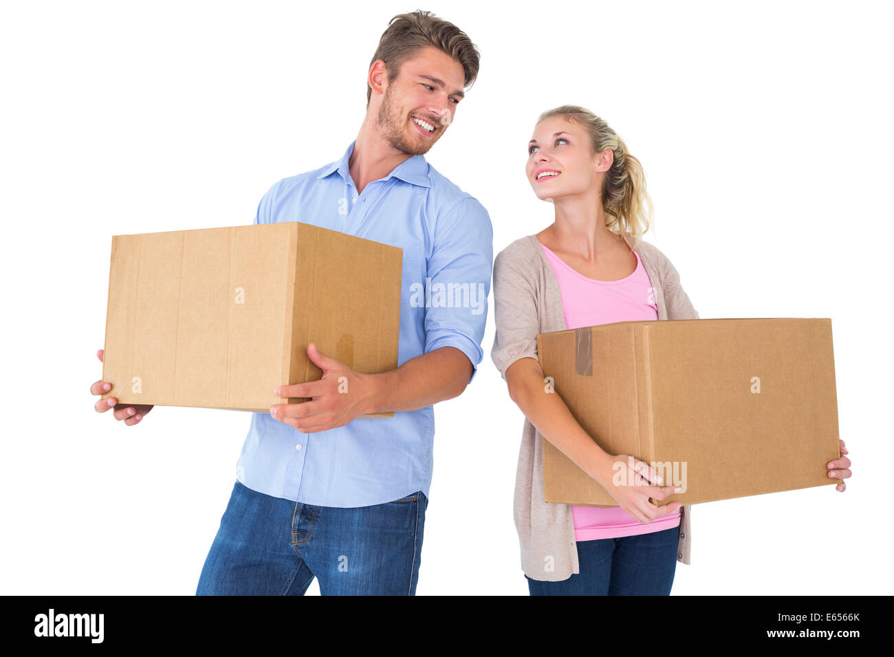 Attractive young couple carrying moving boxes Stock Photo - Alamy