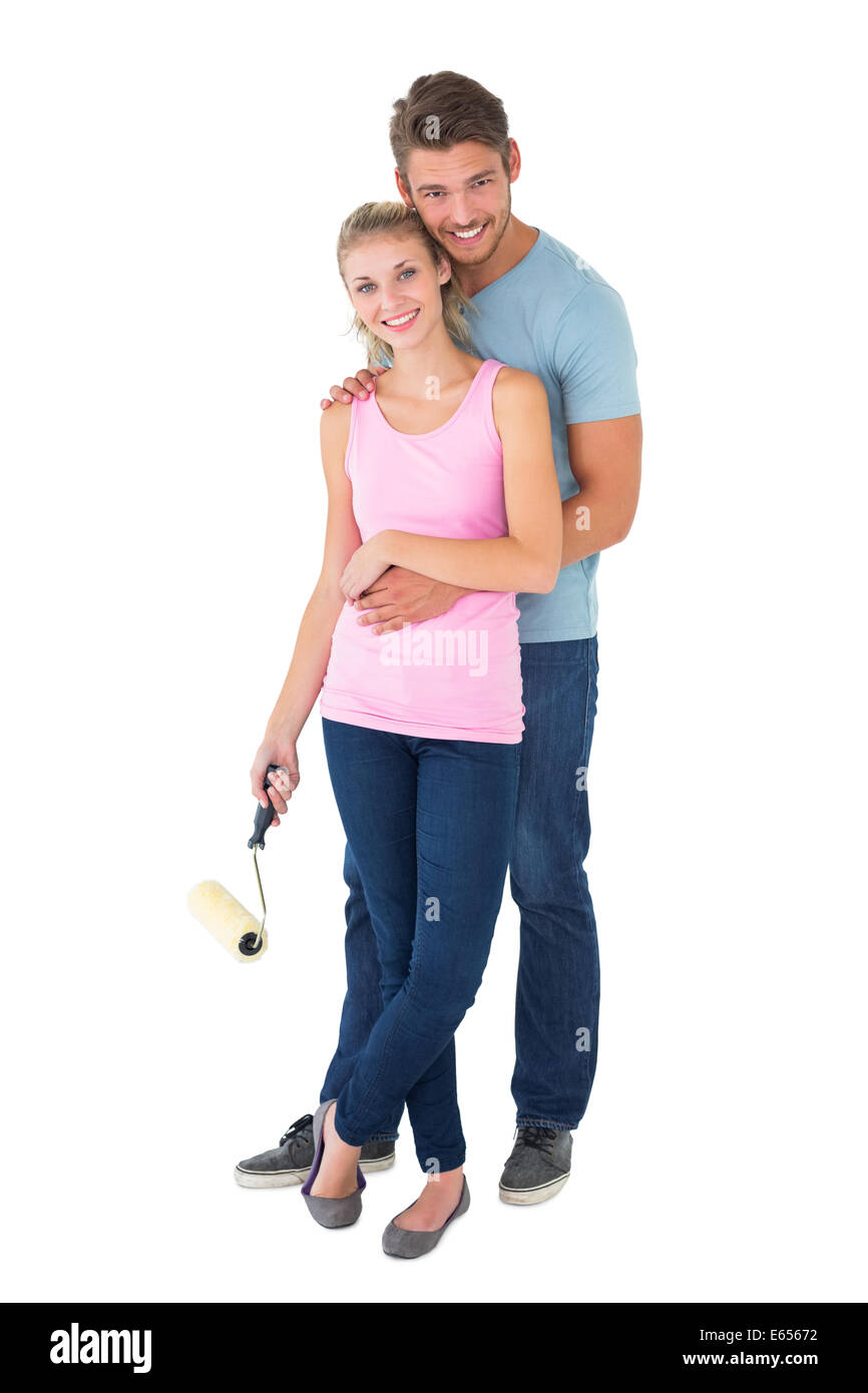 Embracing couple standing home Cut Out Stock Images & Pictures - Alamy