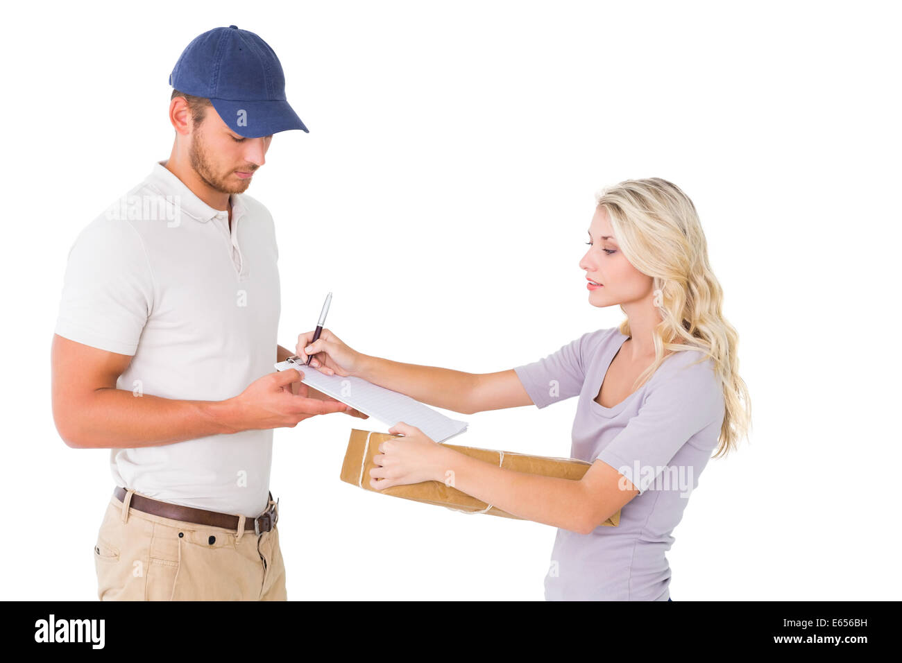 Happy delivery man giving package to customer Stock Photo - Alamy