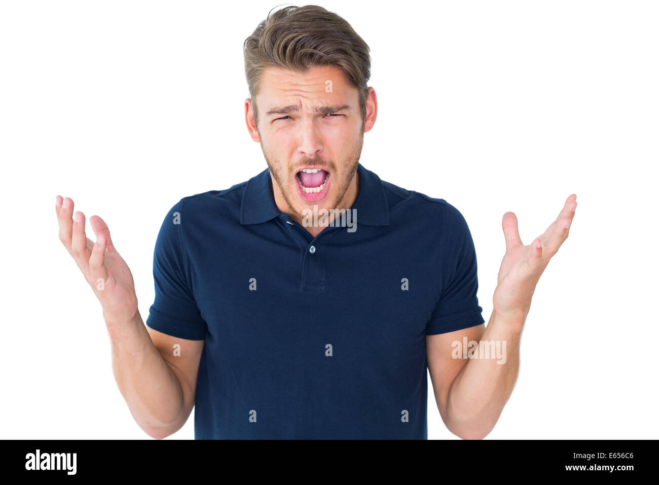 Handsome young man shrugging shoulders Stock Photo - Alamy