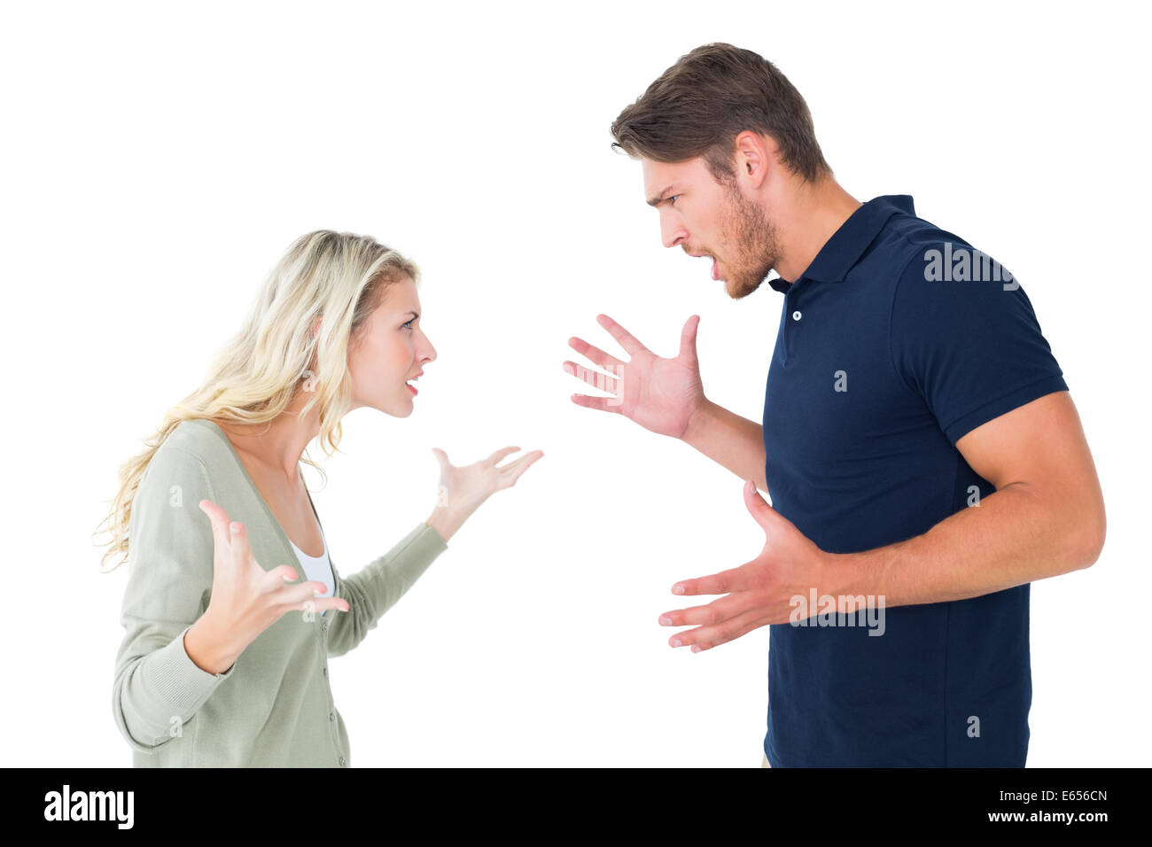 Angry couple facing off during argument Stock Photo - Alamy