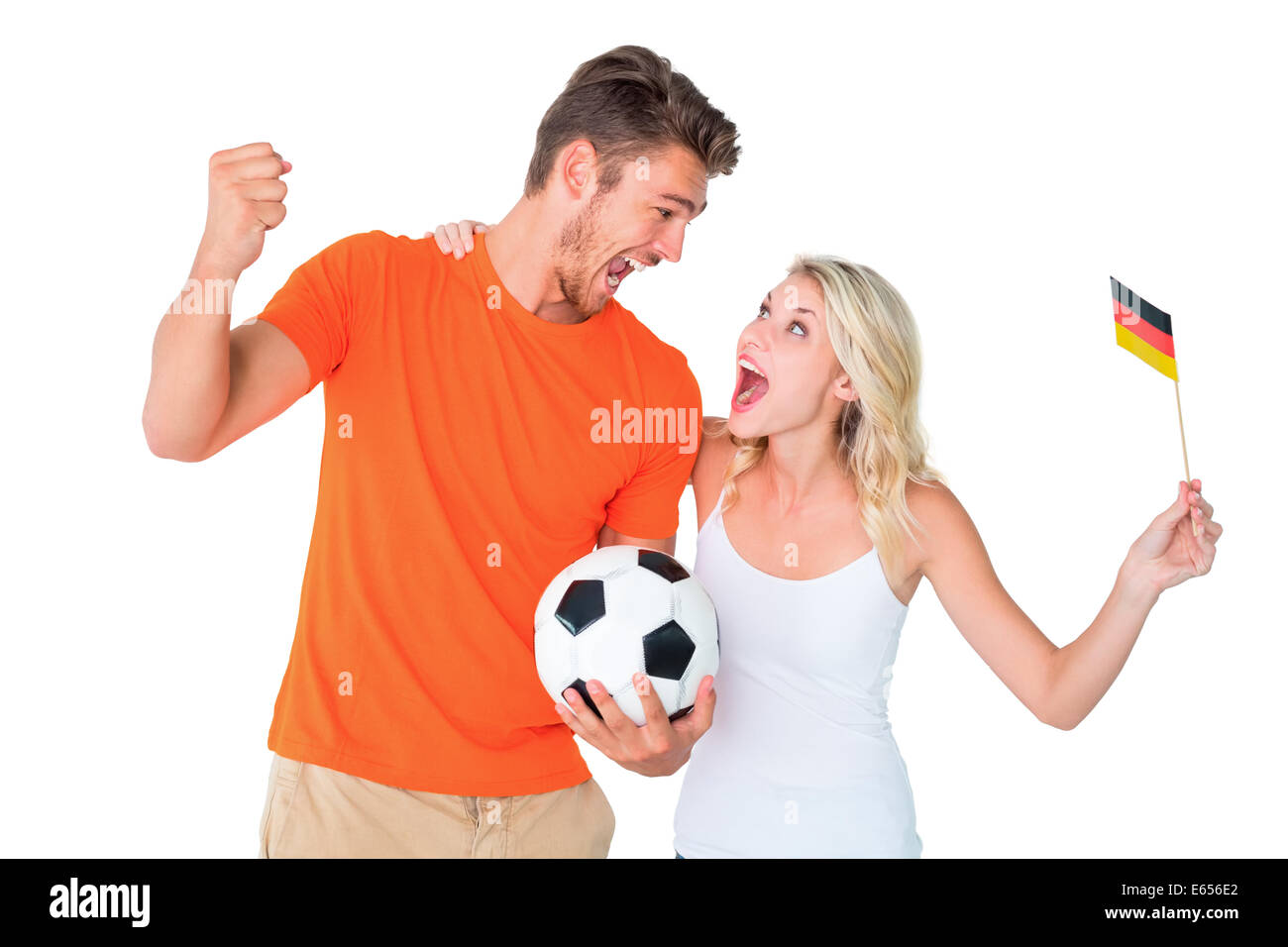 Excited football fan couple cheering Stock Photo - Alamy