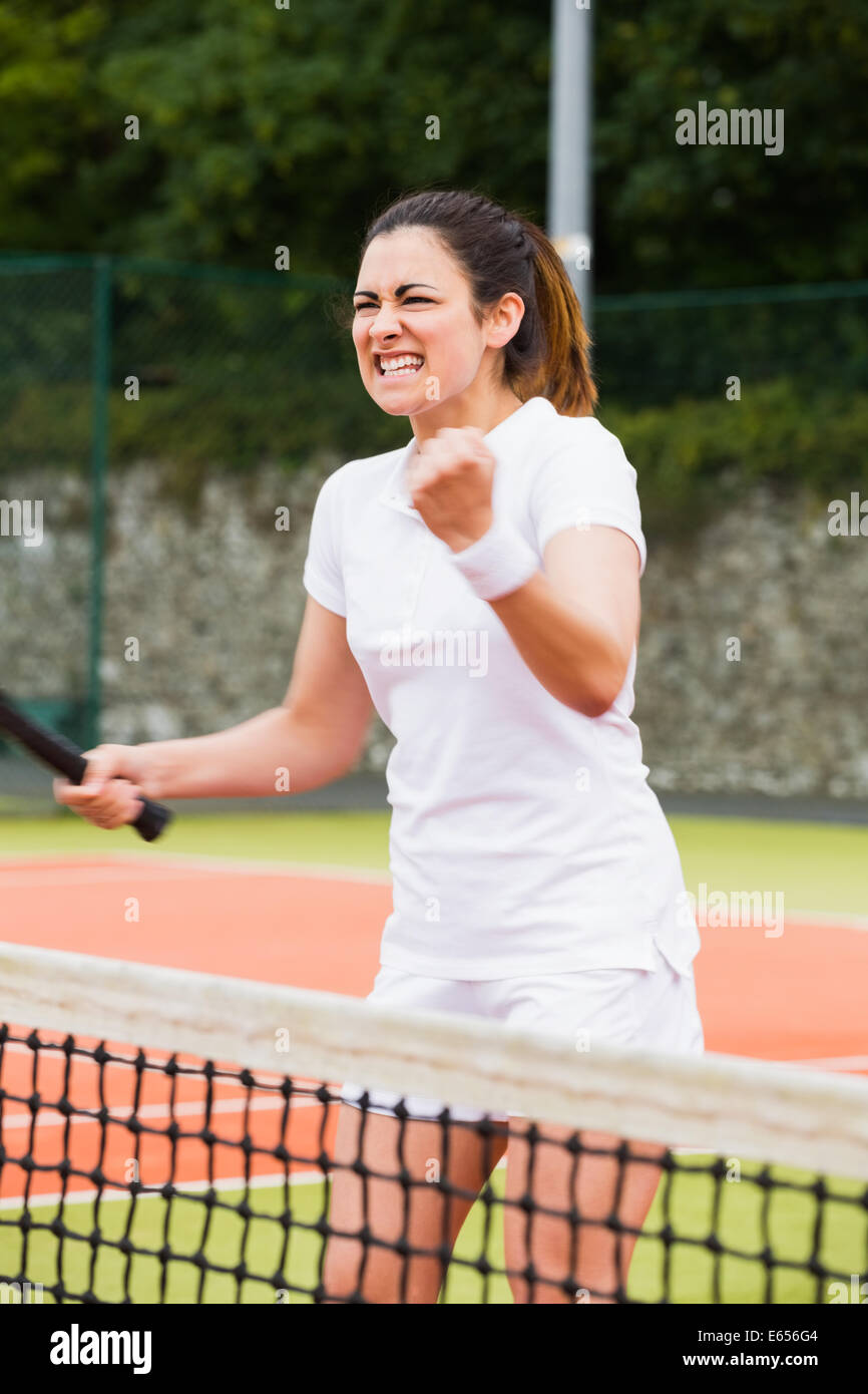 Pretty tennis player celebrating a win Stock Photo - Alamy