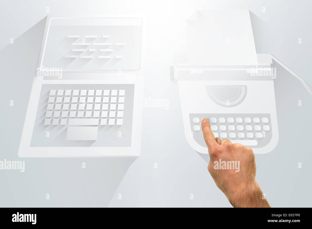 Hand pointing against laptop and typewriter Stock Photo - Alamy