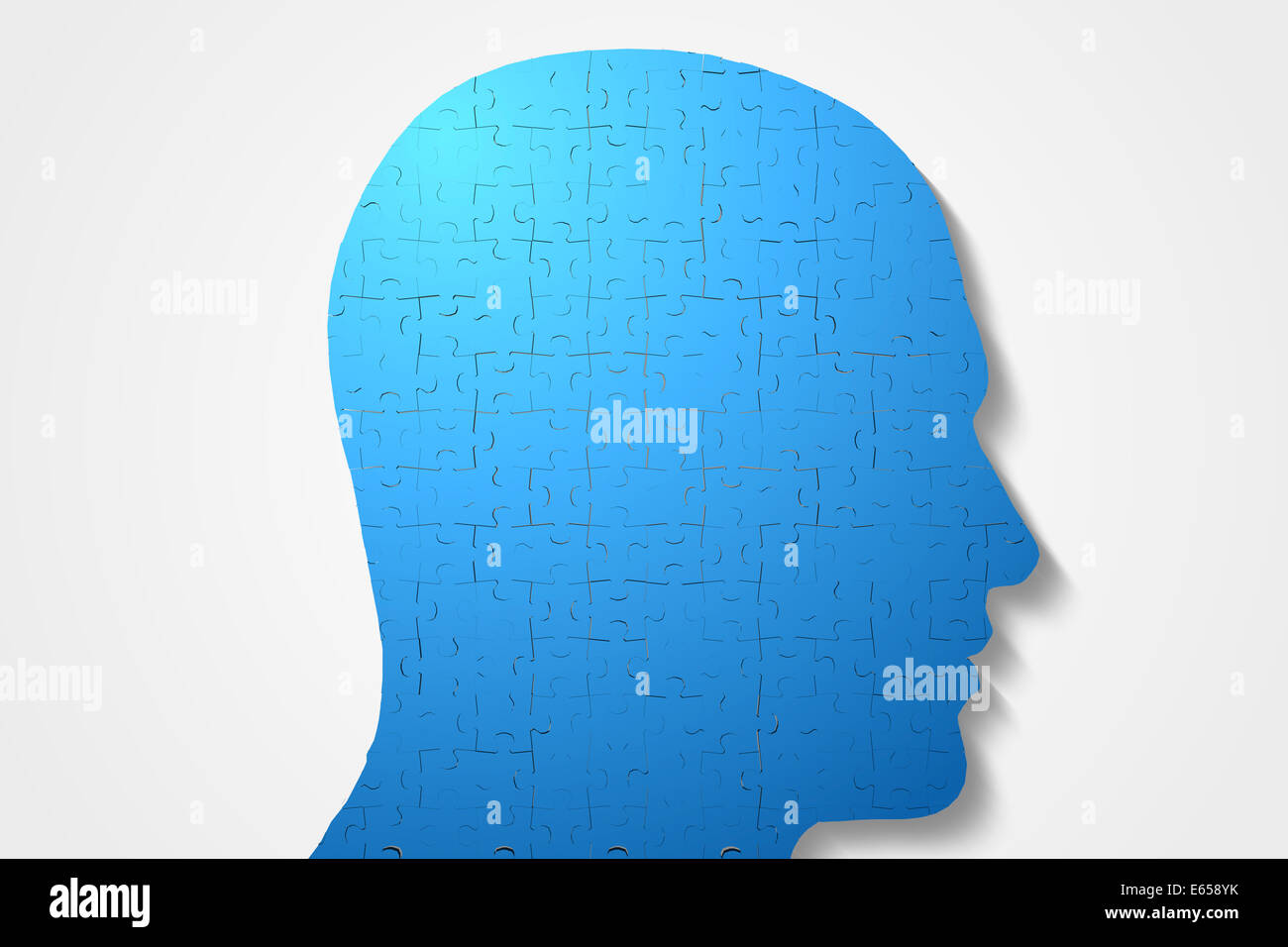 Blue head made of jigsaw pieces Stock Photo - Alamy