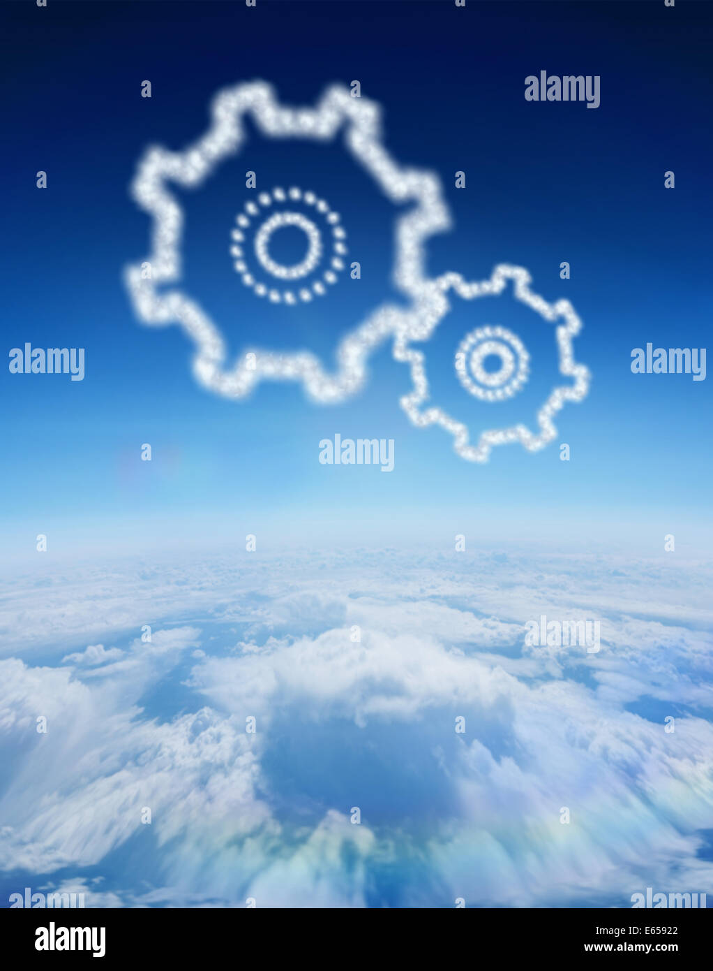 Composite image of cloud in shape of cogs and wheels Stock Photo - Alamy