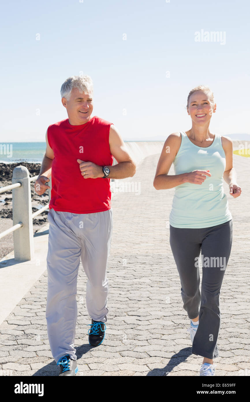 Couple running on pier hi-res stock photography and images - Alamy