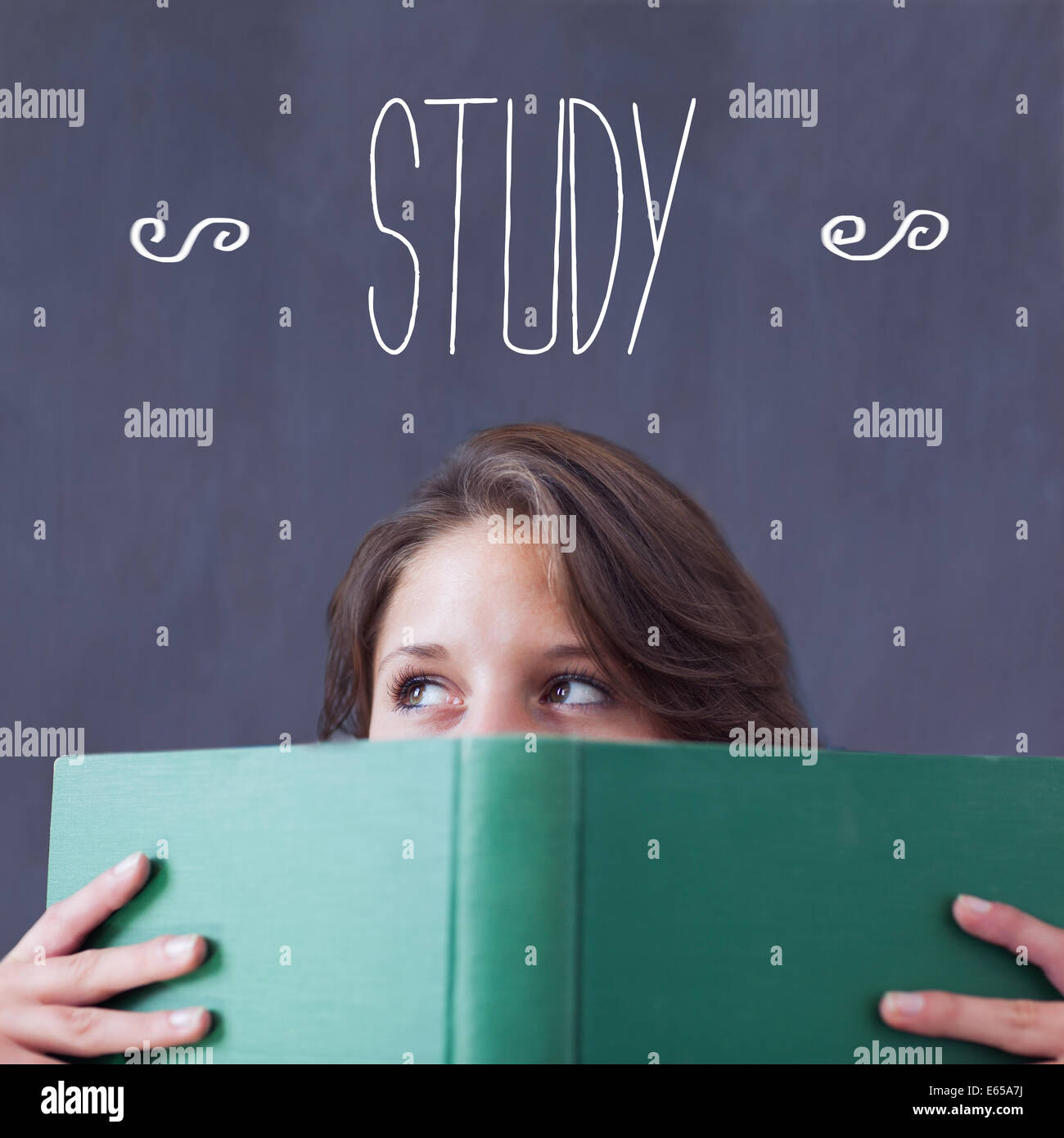 Study against student holding book Stock Photo - Alamy