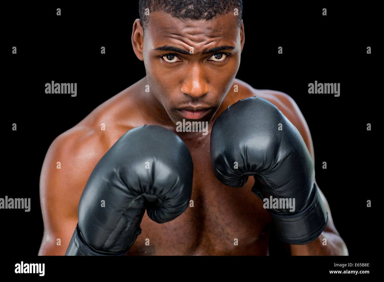 Portrait of shirtless muscular boxer in defensive stance Stock Photo ...