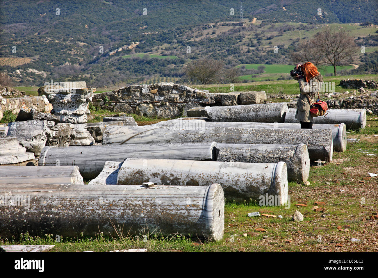 Lonely lady photographer at the archaeological site of Ancient ...