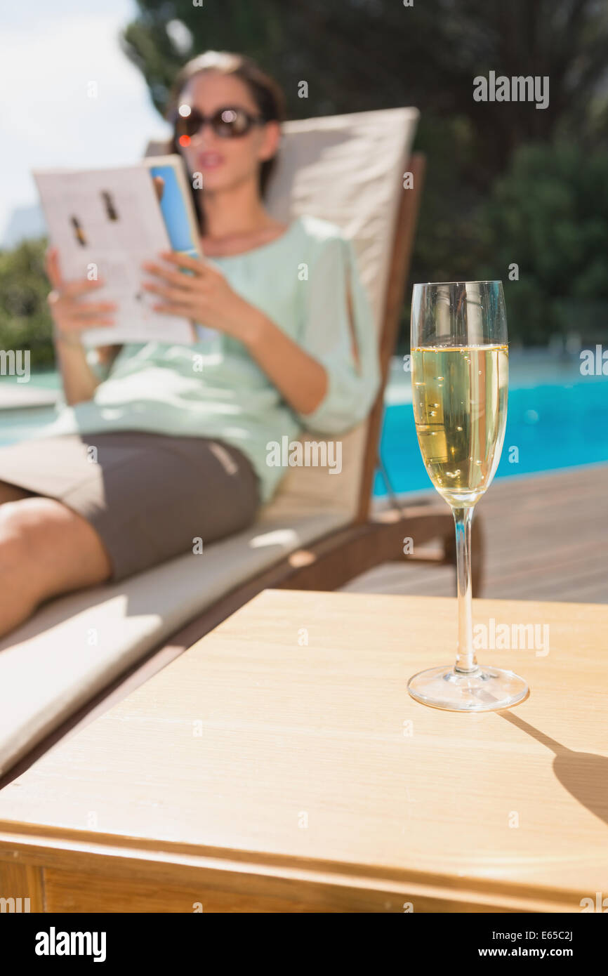 Woman reading book in swimming pool hi-res stock photography and images ...
