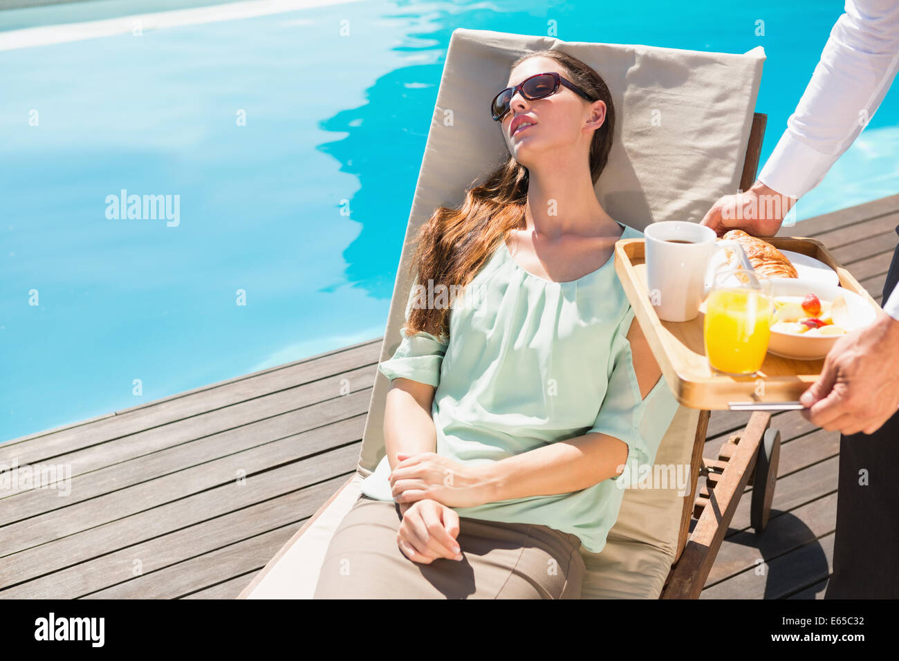 Pool waiter lounger hi-res stock photography and images - Alamy