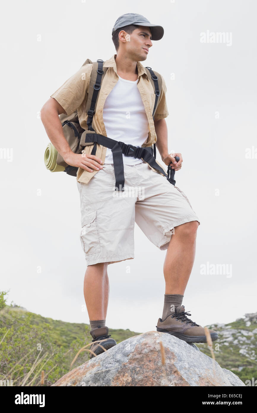 Hiking man standing on mountain terrain Stock Photo - Alamy