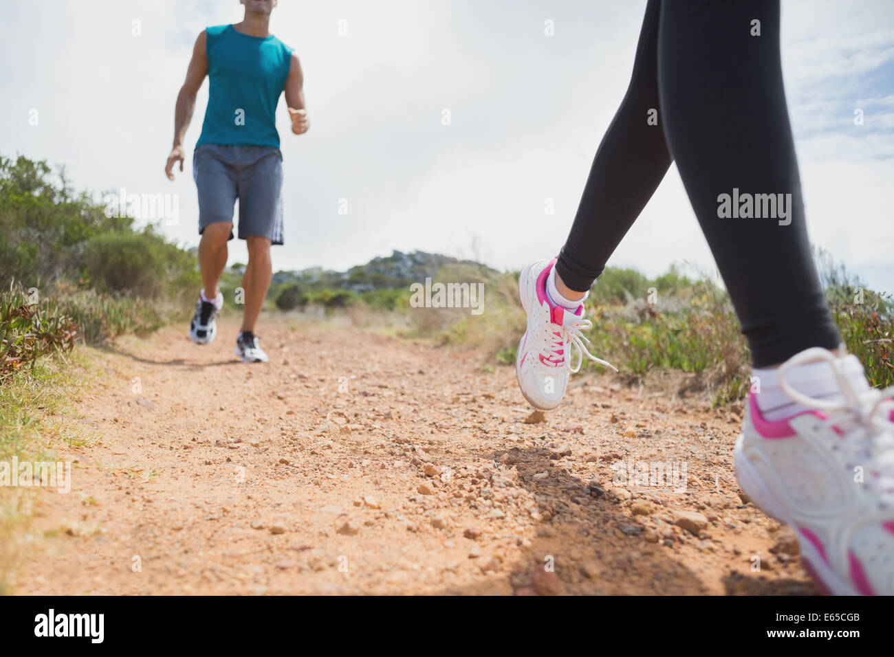 Woman jogging on countryside road hi-res stock photography and images ...