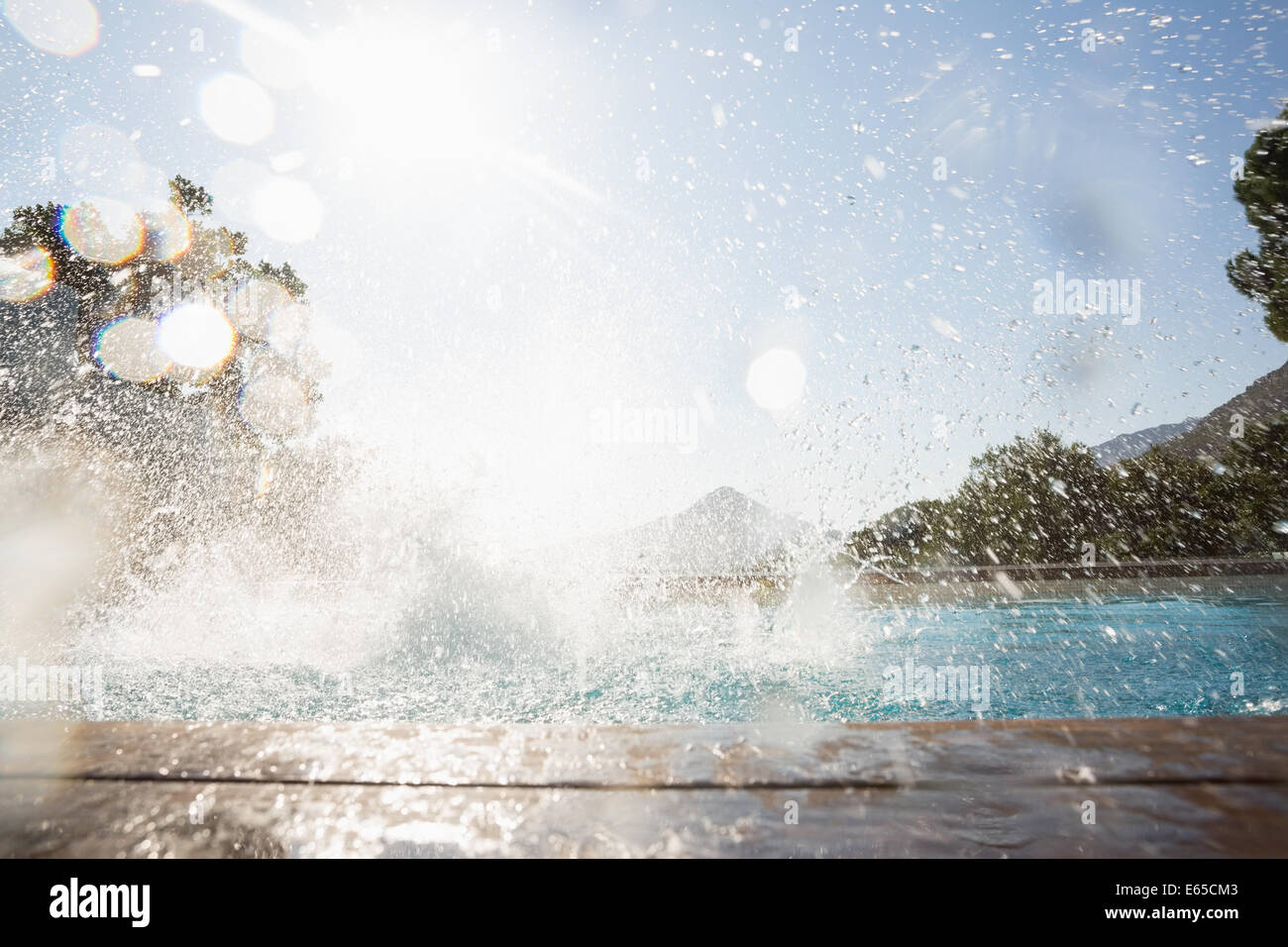 Splashing water in swimming pool Stock Photo - Alamy