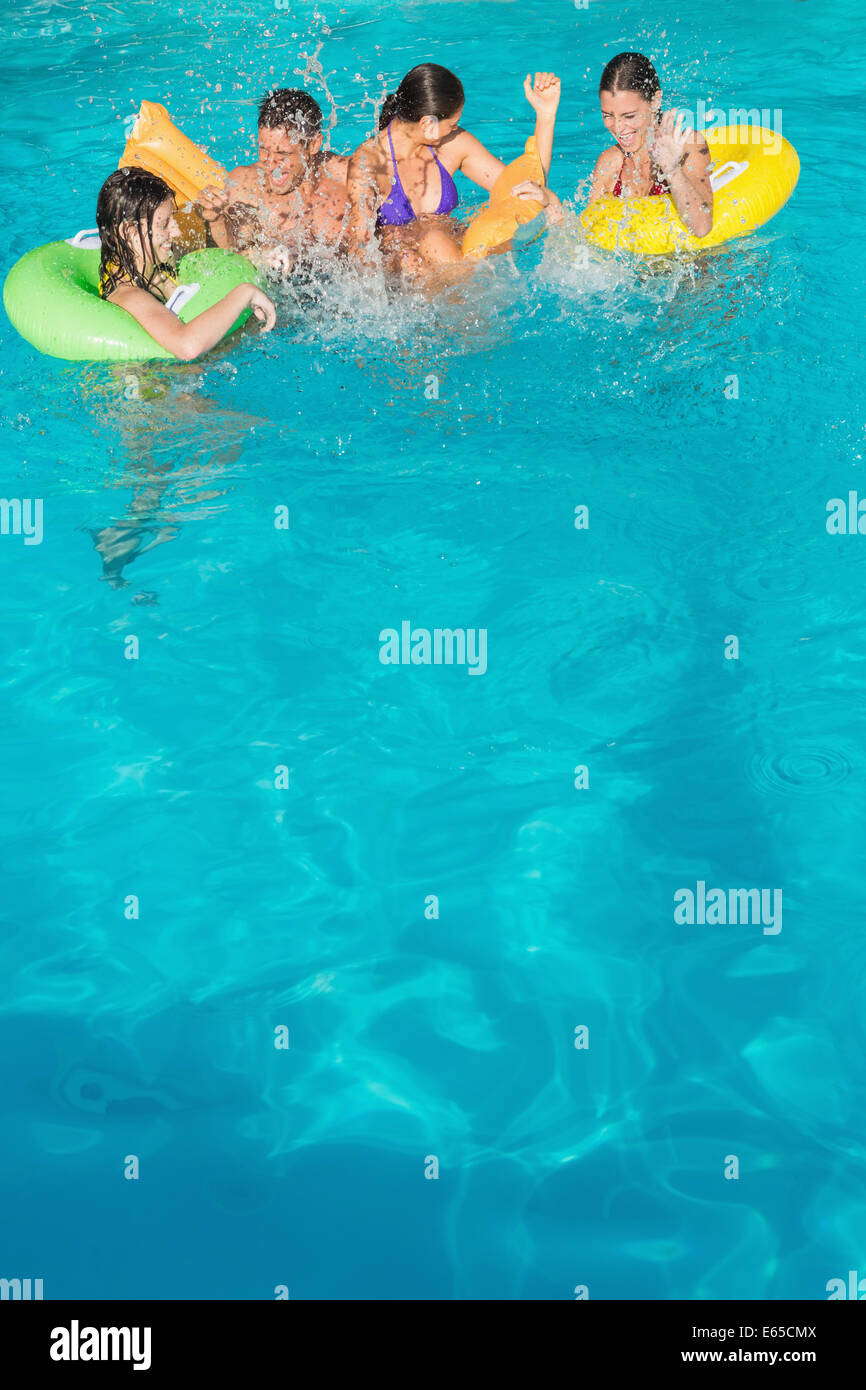 People playing in the swimming pool Stock Photo - Alamy