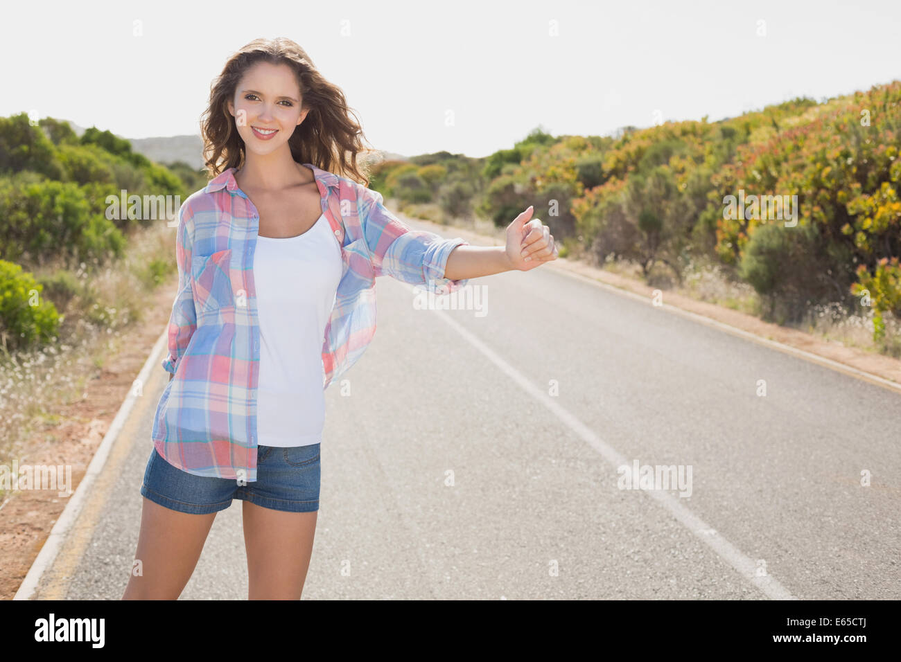 Young female hitchhiker standing roadside hi-res stock photography and ...