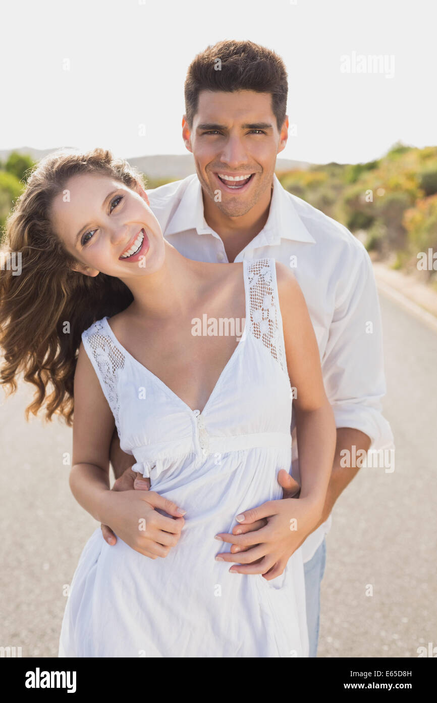 Loving couple standing on countryside road Stock Photo - Alamy