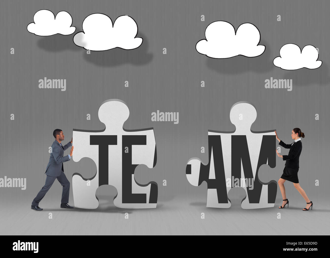 Team against grey jigsaw pieces Stock Photo - Alamy