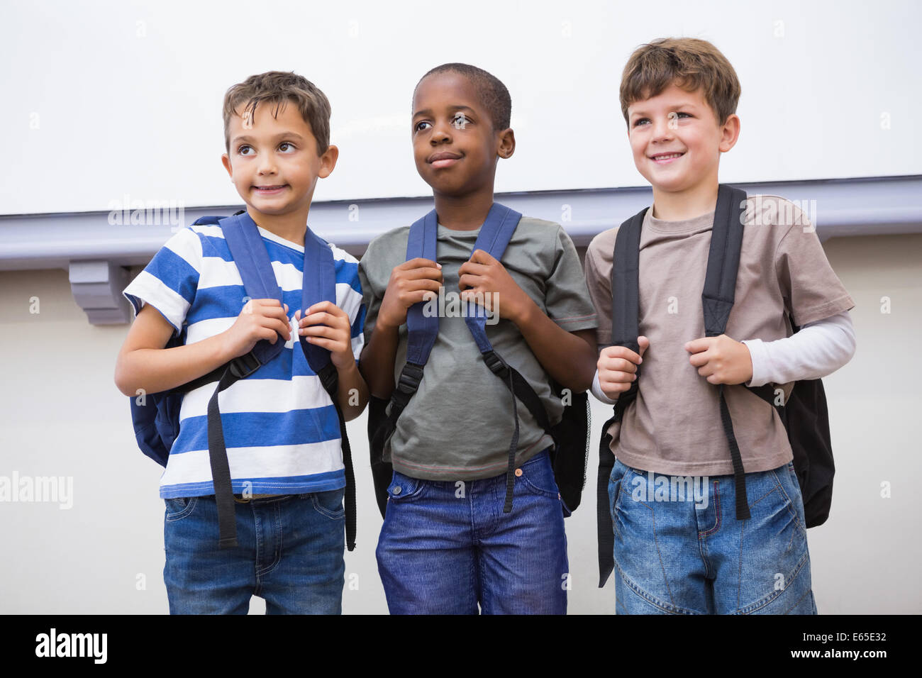 Classmates smiling together in classroom Stock Photo - Alamy