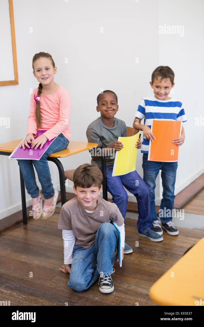 Classmates smiling together in classroom Stock Photo - Alamy