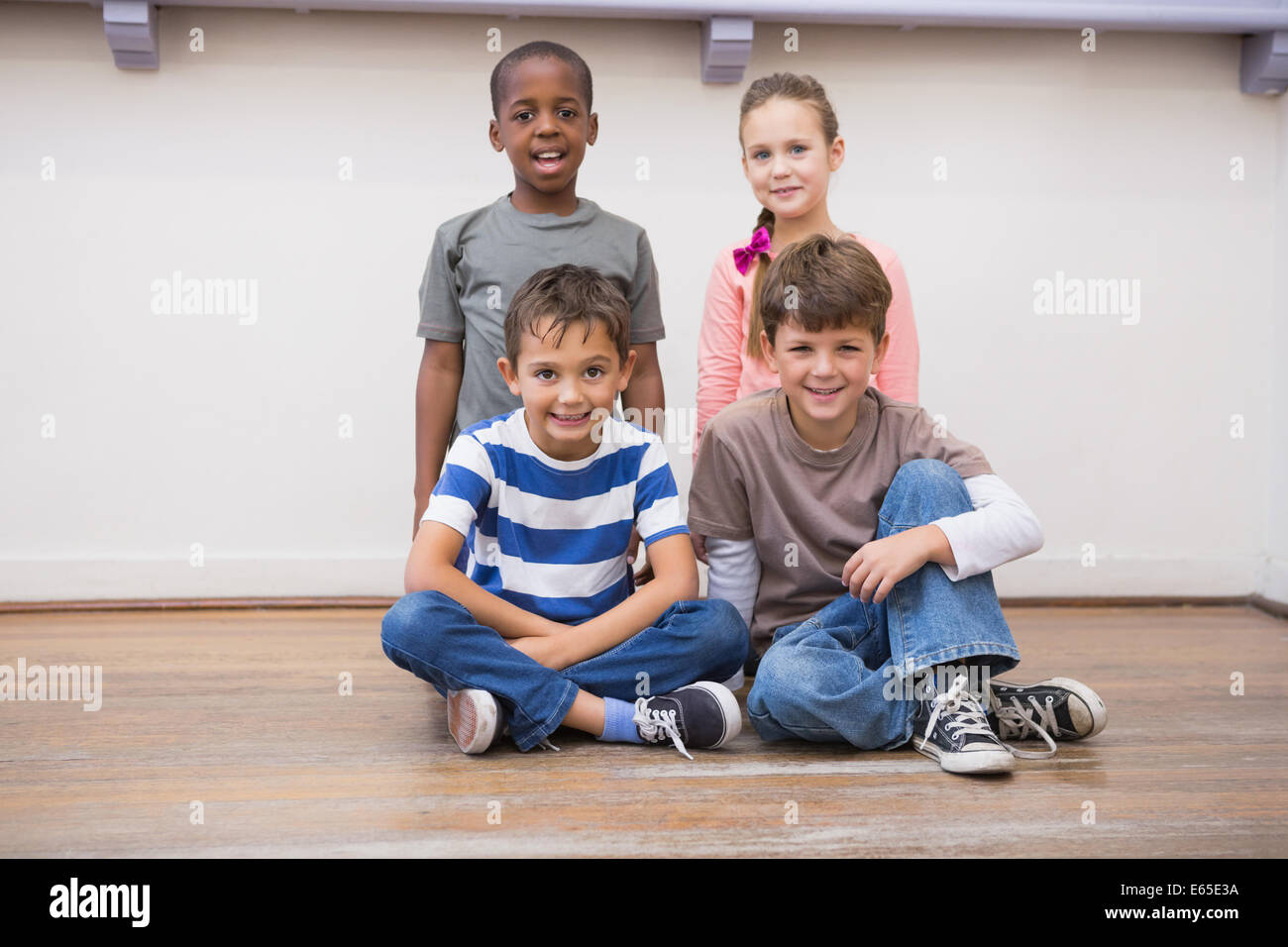 Classmates smiling together in classroom Stock Photo - Alamy
