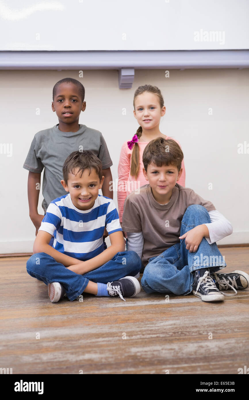 Classmates smiling together in classroom Stock Photo - Alamy