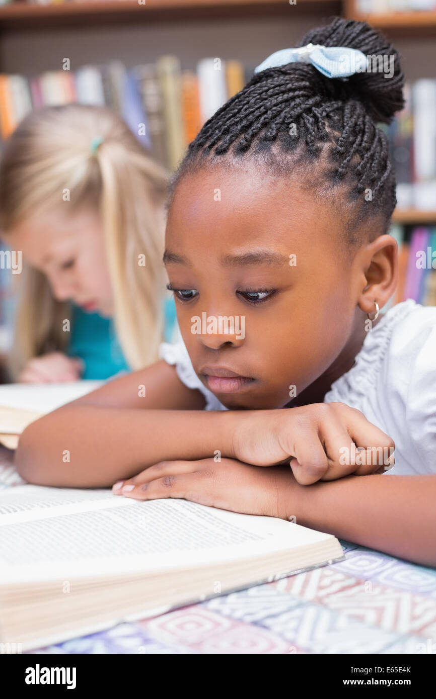 Pupils reading books in library hi-res stock photography and images - Alamy