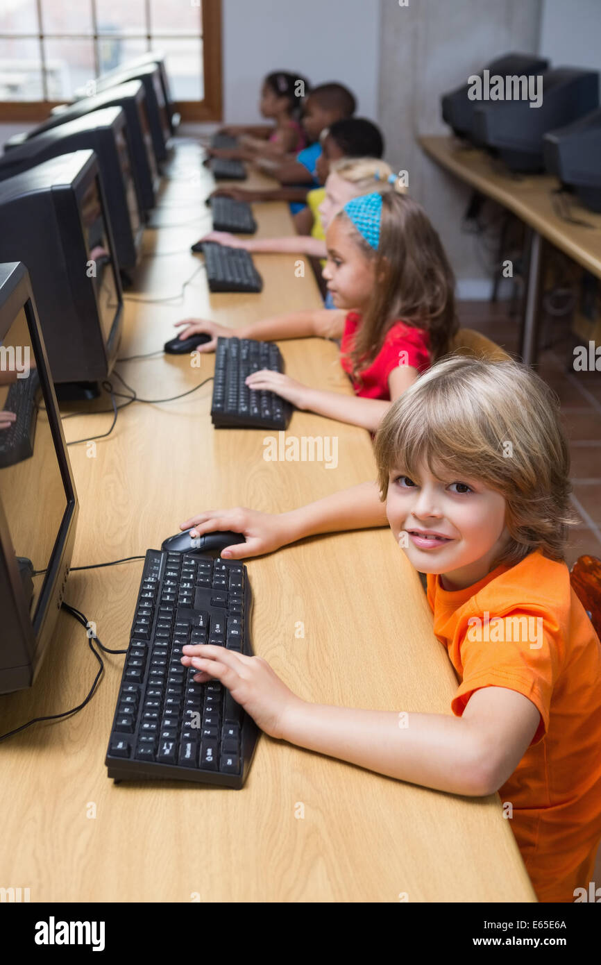 Cute pupils in computer class Stock Photo - Alamy
