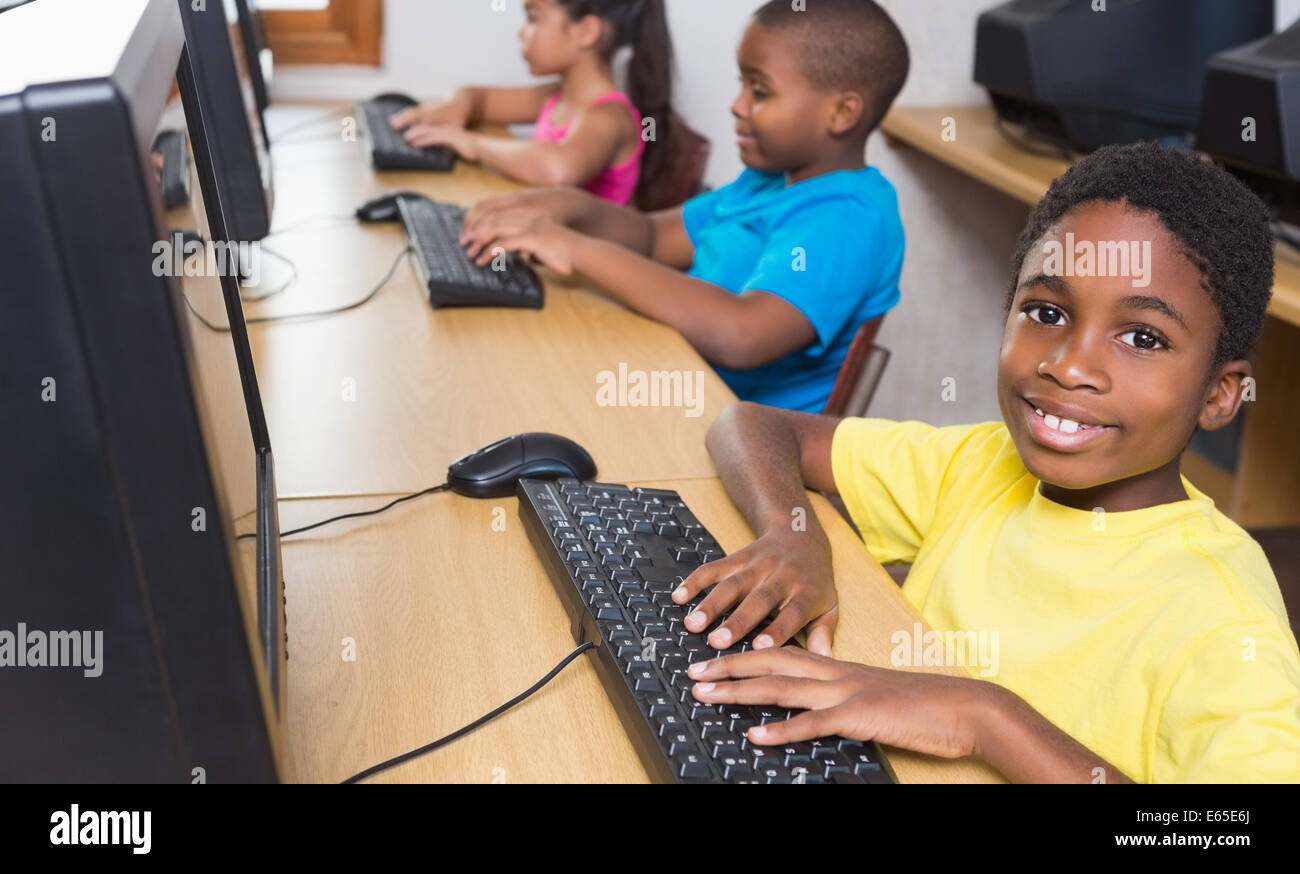 Cute pupils in computer class Stock Photo - Alamy