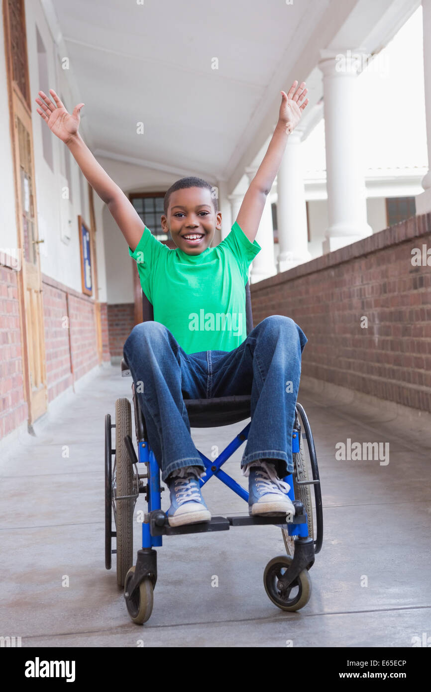 Cute disabled pupil smiling at camera in hall Stock Photo - Alamy