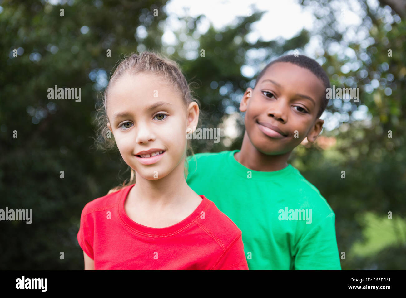 Cute children smiling at camera outside Stock Photo - Alamy