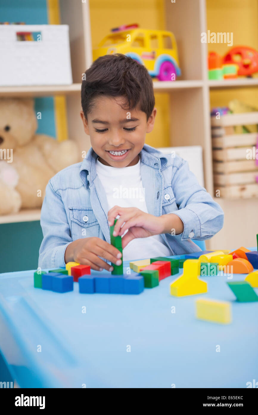 Boy playing building blocks hi-res stock photography and images - Alamy