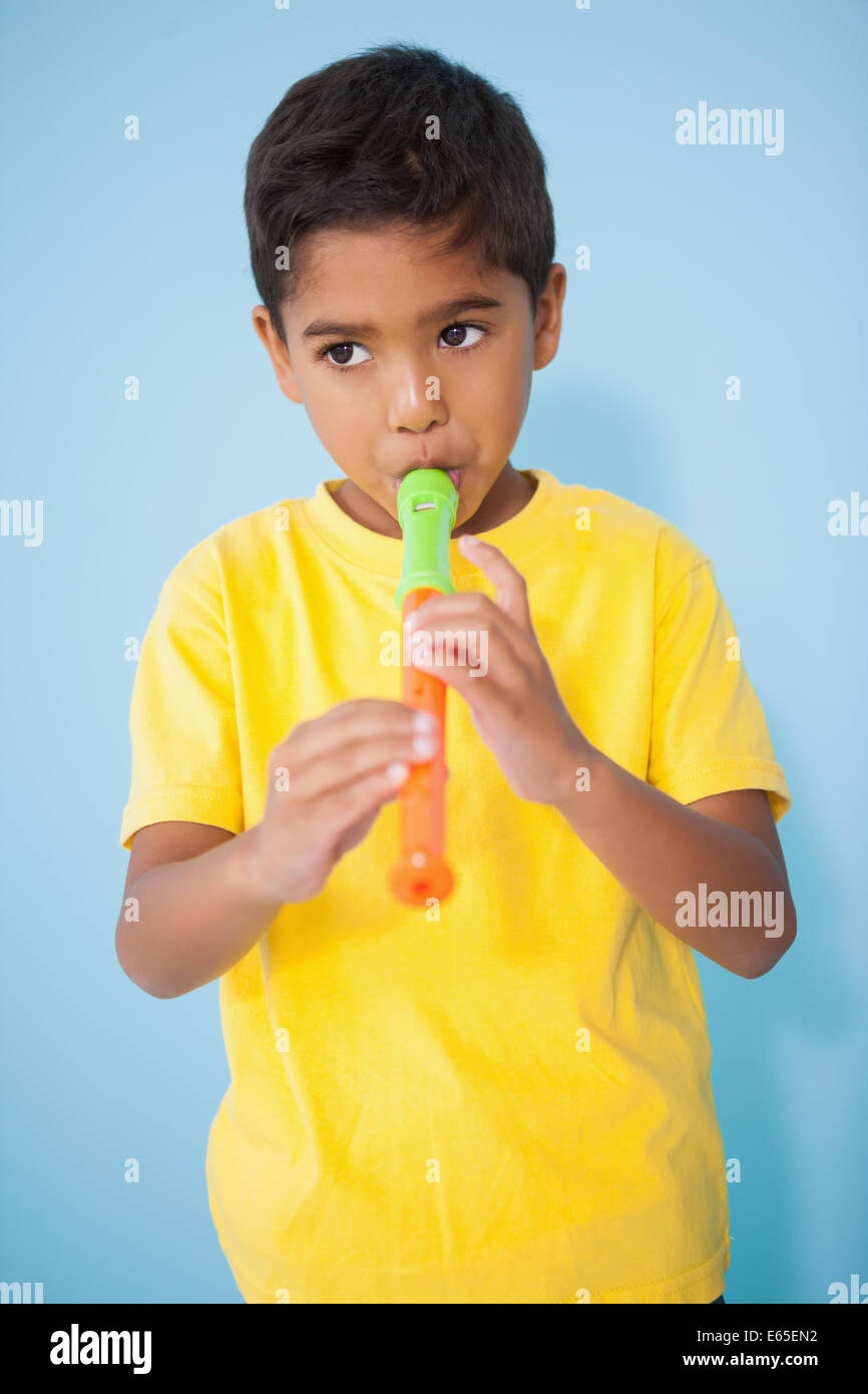 Cute little boy playing the recorder in classroom Stock Photo - Alamy