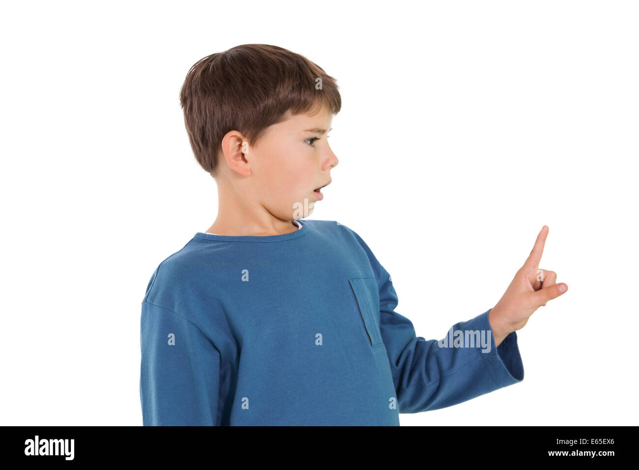 Surprised little boy pointing up Stock Photo - Alamy