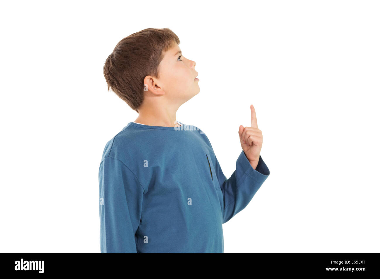 Cute little boy pointing up Stock Photo - Alamy