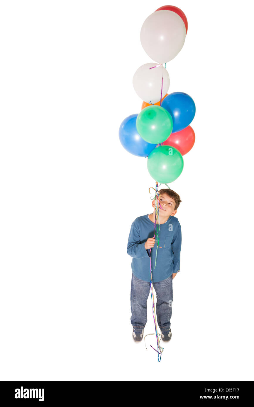 Happy little boy holding bunch of balloons Stock Photo - Alamy