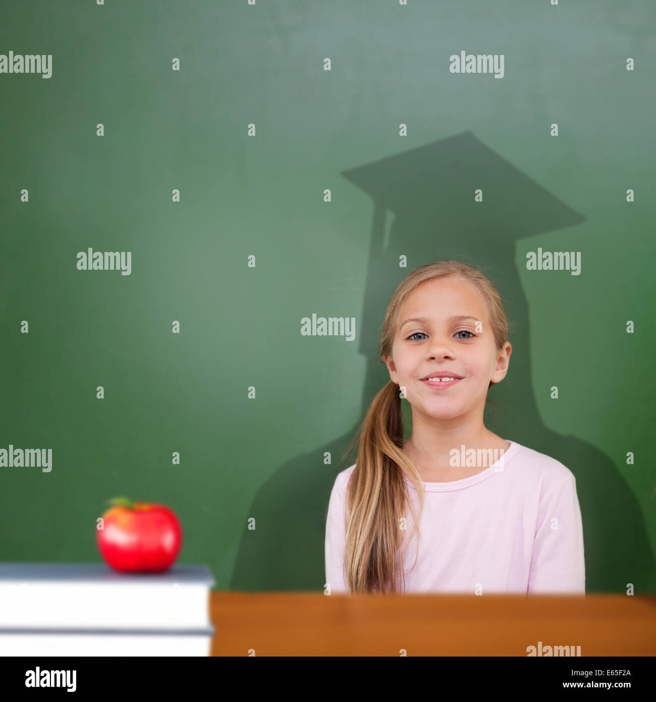 Composite image of cute pupil with graduate shadow Stock Photo - Alamy