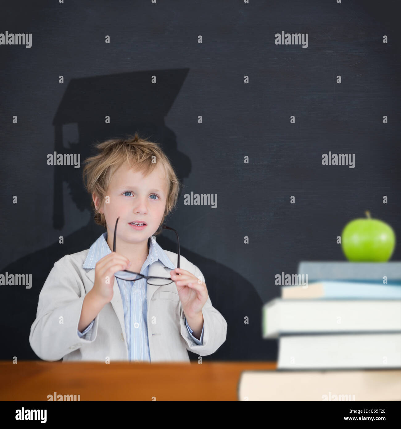 Composite image of cute pupil with graduate shadow Stock Photo - Alamy