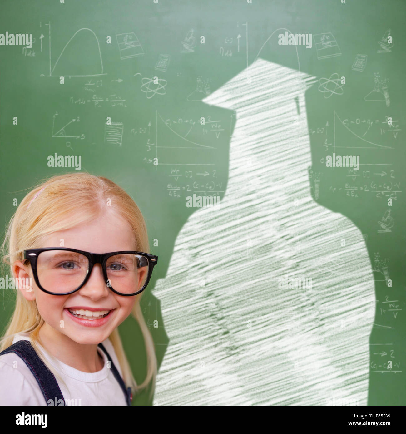 Composite image of cute pupil with graduate outline Stock Photo - Alamy