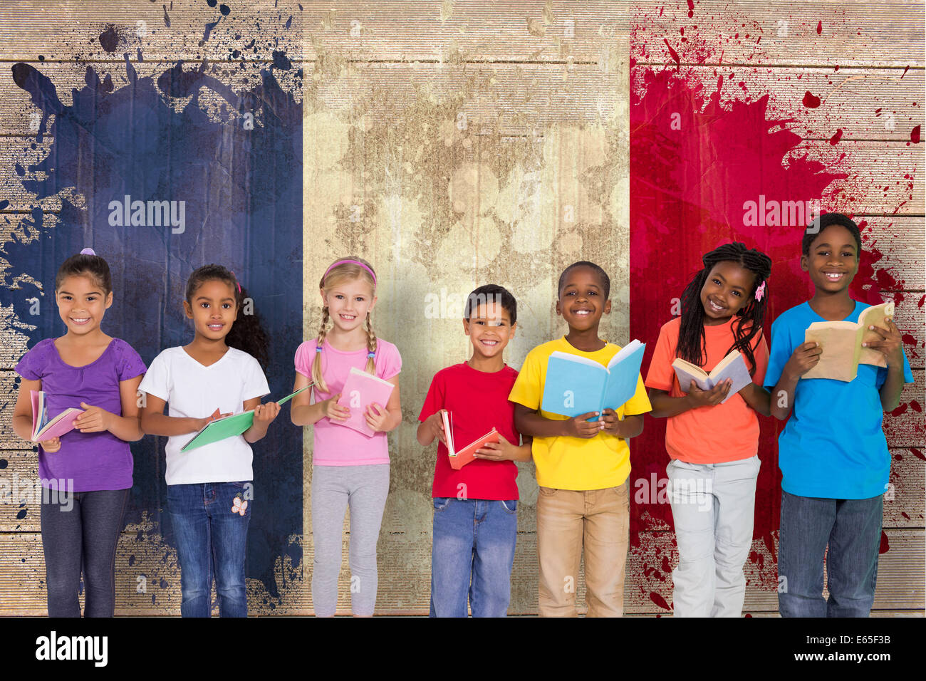 Cute pupils reading books desk hi-res stock photography and images - Alamy