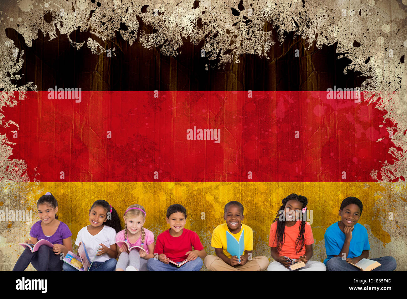 Composite image of elementary pupils reading books Stock Photo - Alamy