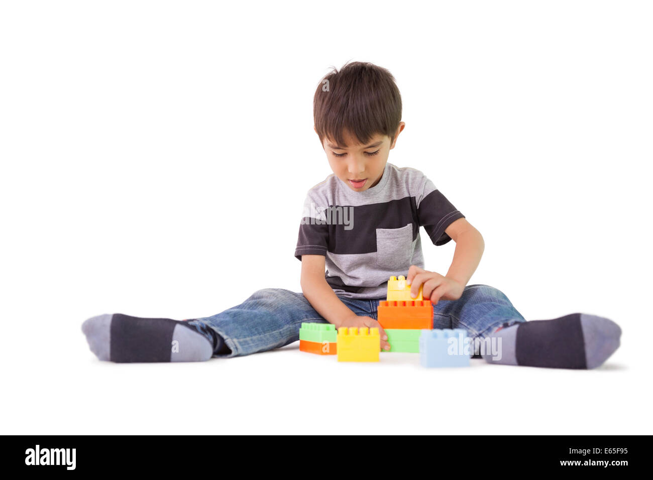 Happy little boy playing with building blocks Stock Photo - Alamy