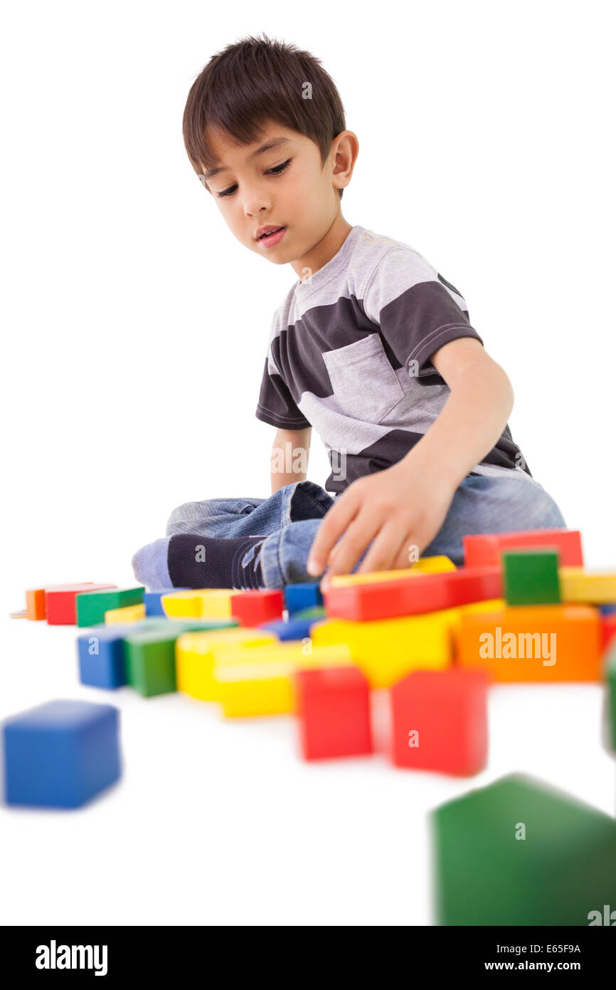 Happy little boy playing with building blocks Stock Photo - Alamy