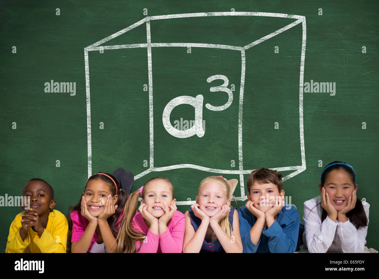 Composite image of cute pupils smiling at camera Stock Photo - Alamy