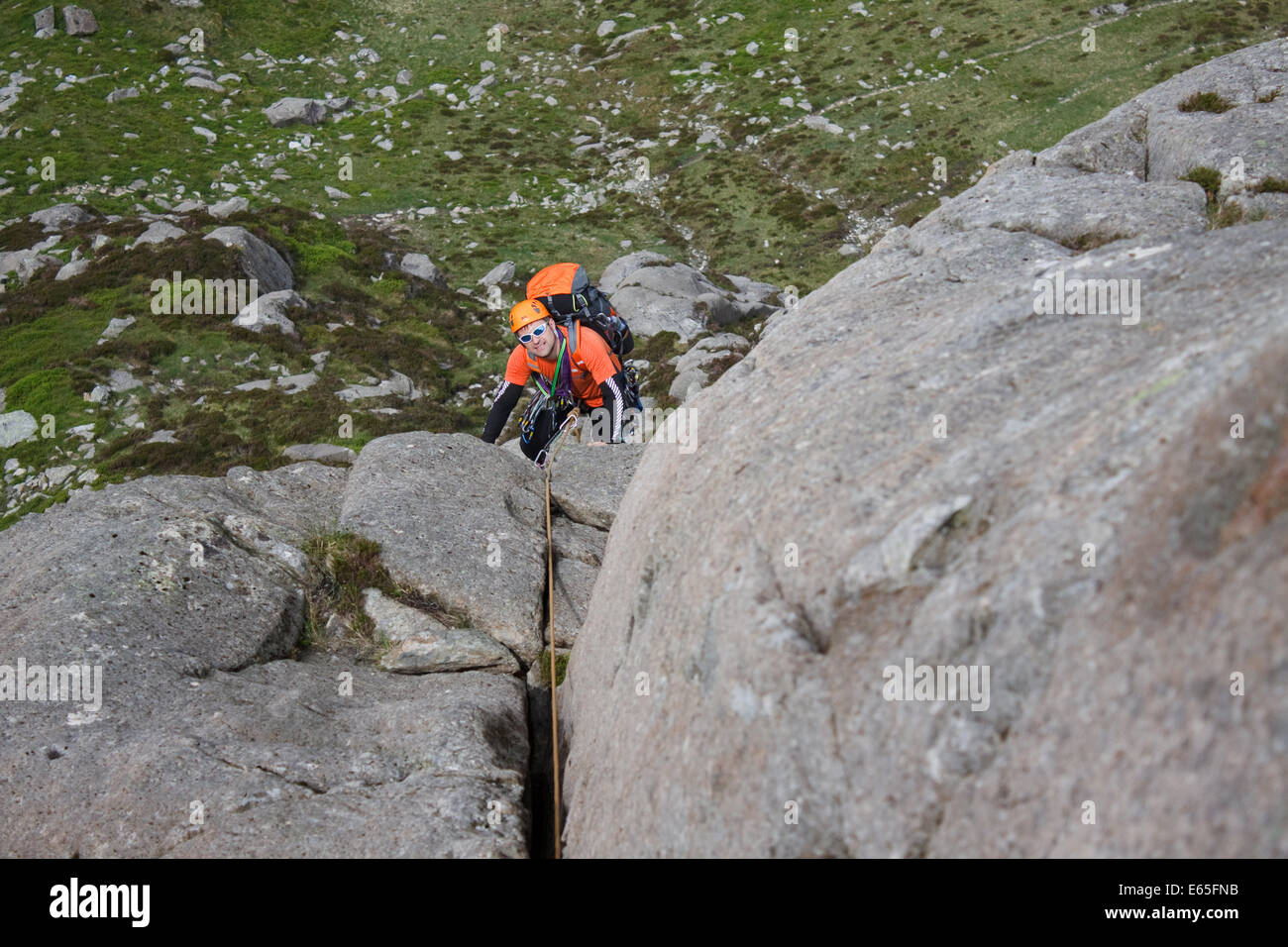 A male rock climber on Sub Cneifion Rib in Cwm Idwal above the Ogwen ...