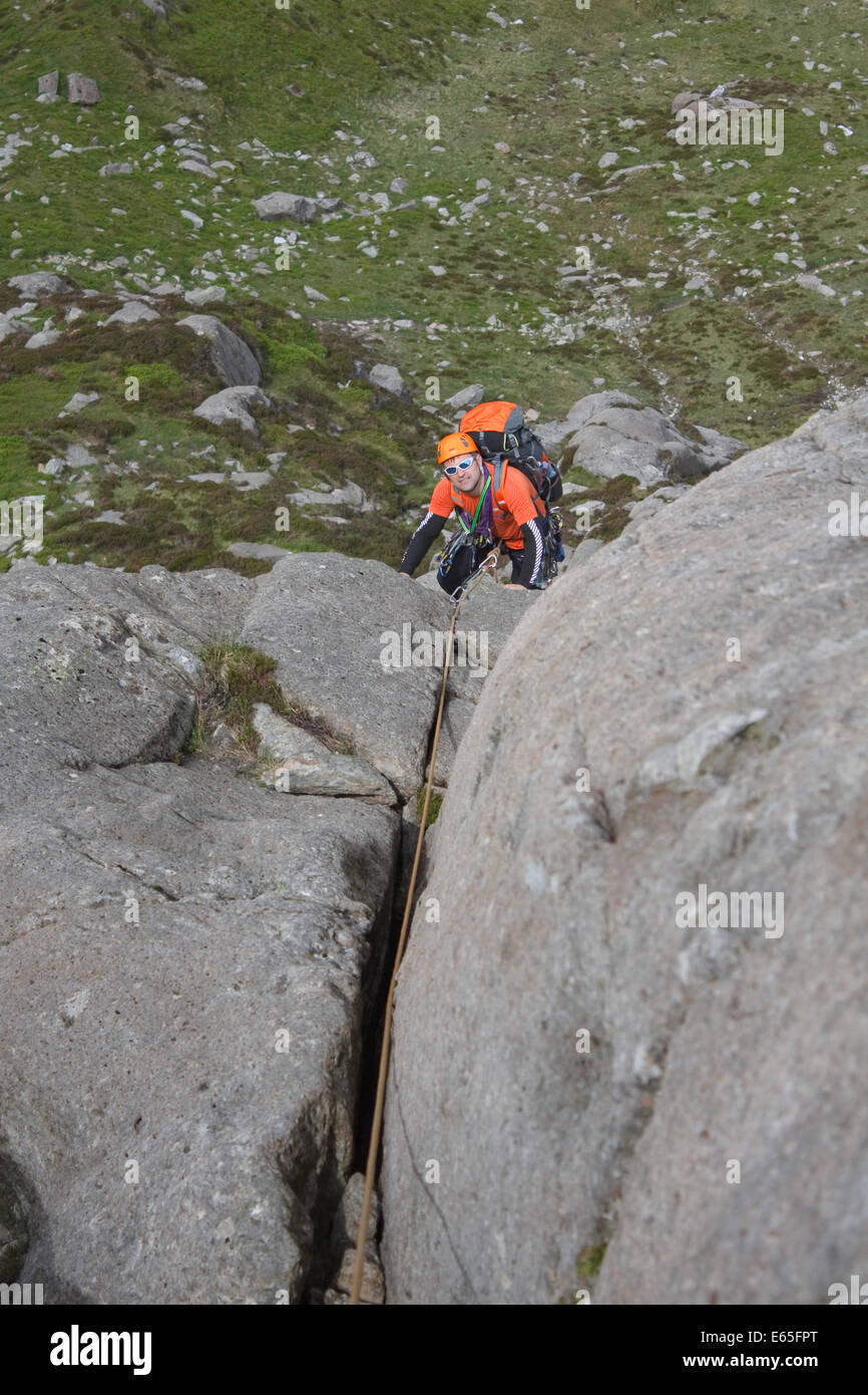 A male rock climber on Sub Cneifion Rib in Cwm Idwal above the Ogwen ...