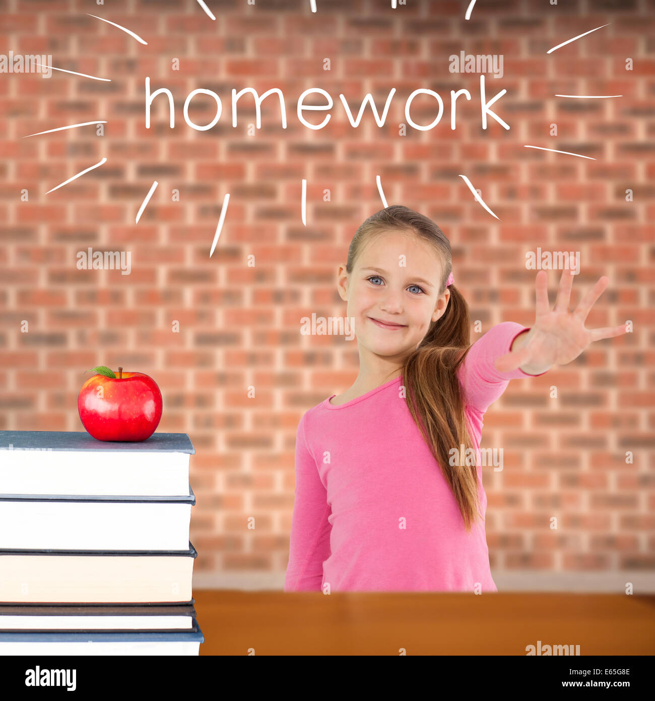 Homework against red apple on pile of books Stock Photo - Alamy