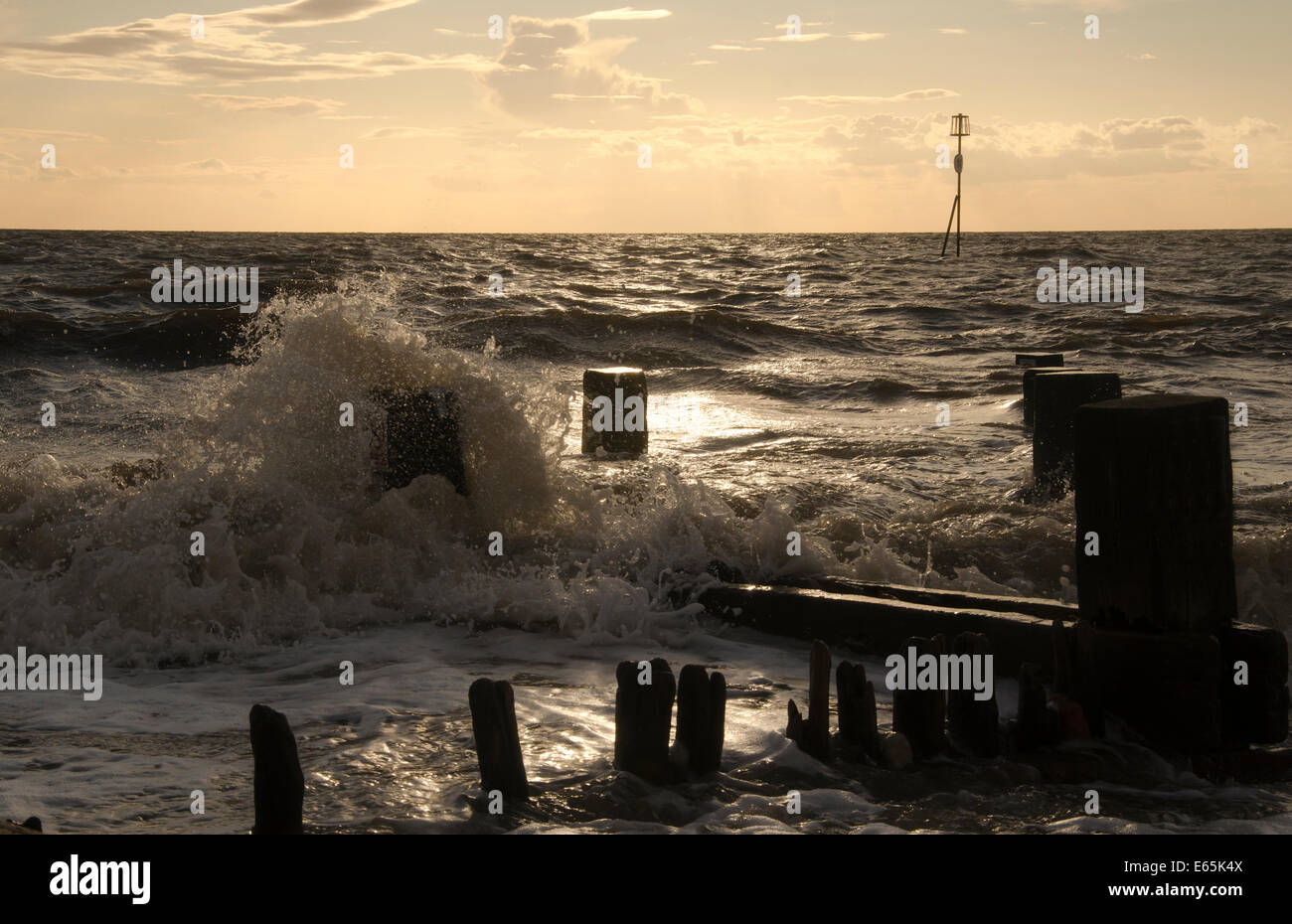 Waves crashing over groyne on Hunstanton Beach, Norfolk Stock Photo - Alamy
